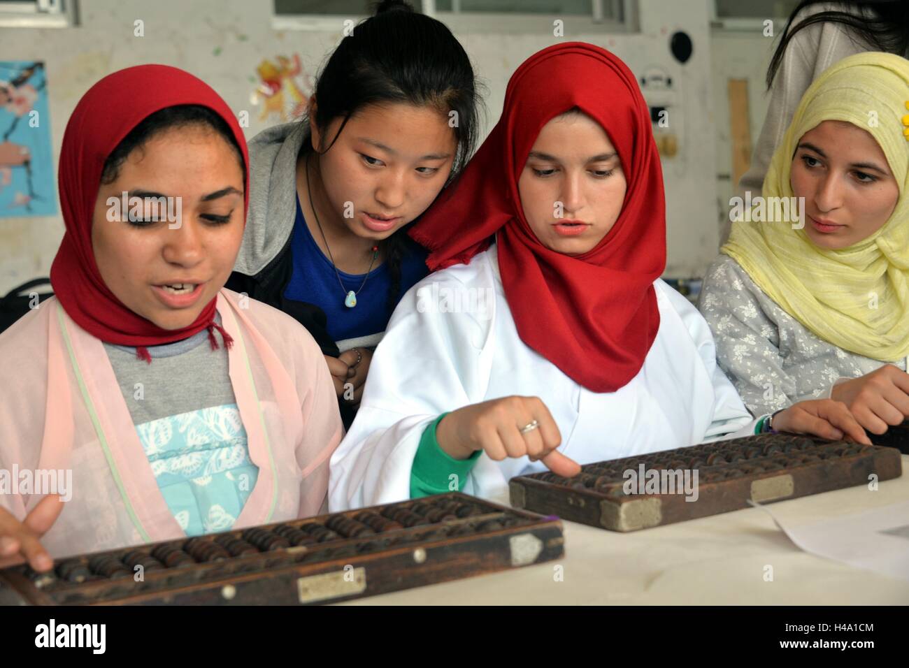 Liaocheng, China. 14th Oct, 2016. Muslim girls are instructed by ...