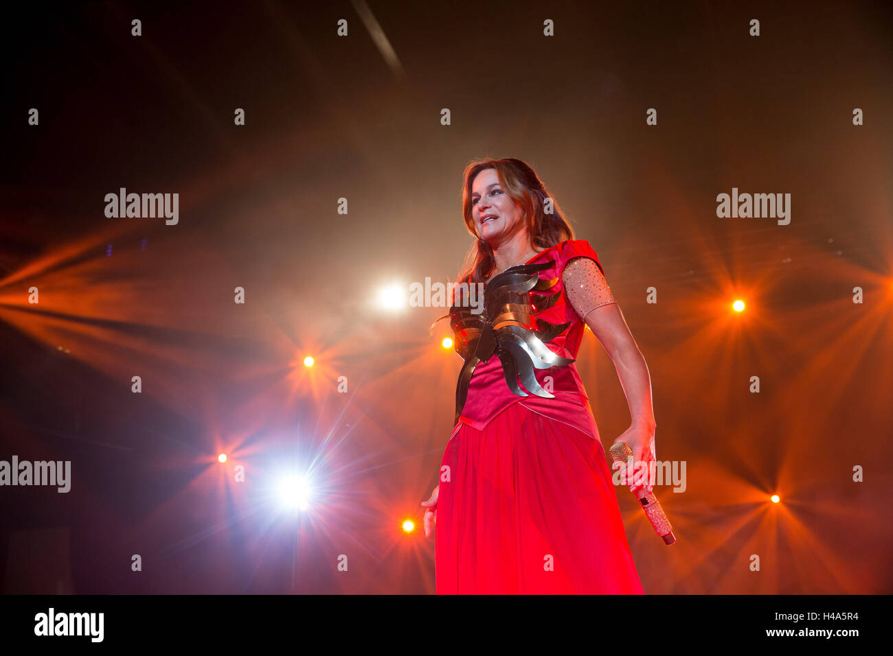 German hit singer Andrea Berg stands on stage during her concert ...