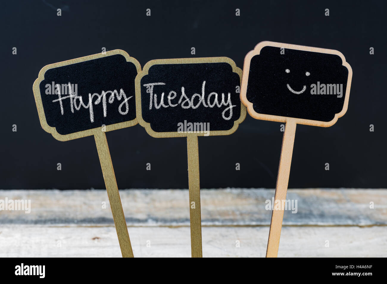 Motivational message Happy Tuesday written with chalk on wooden mini ...