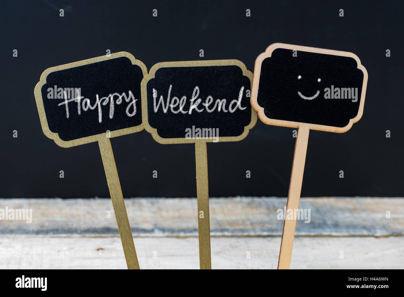 Motivational message Happy Weekend written with chalk on wooden mini ...