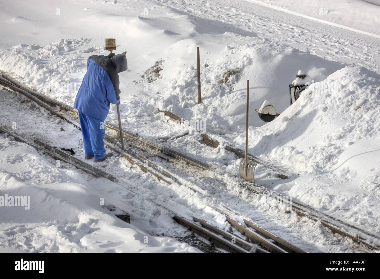 Rail line, snow, man, clearing tracks Stock Photo - Alamy Rail line, snow, man, clearing tracks Stock Photo - Alamy