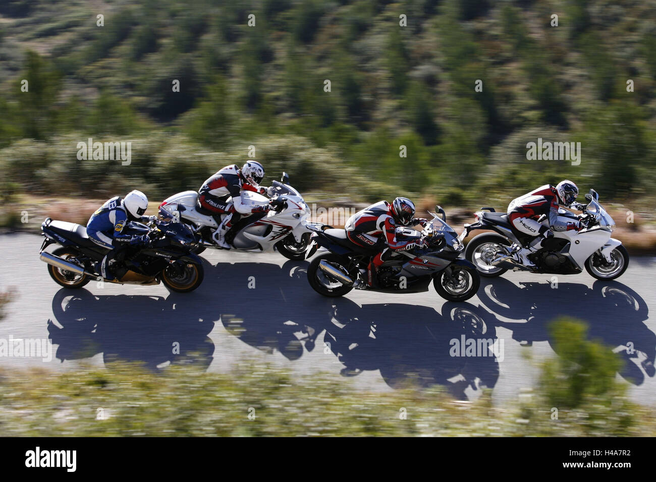 four motorcyclists, motorcycle group, country road the South France ...