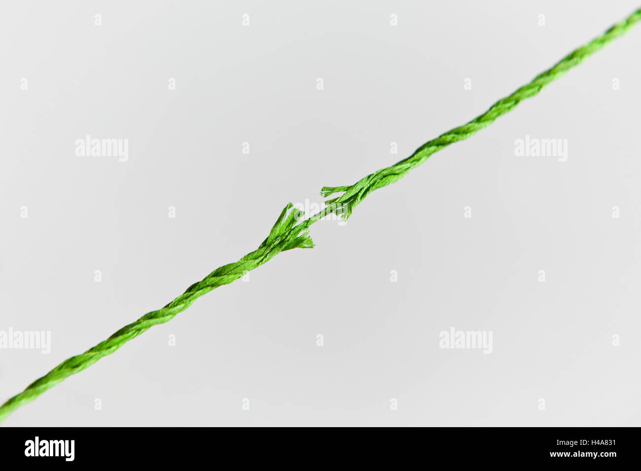 Thread shortly before tearing Stock Photo - Alamy