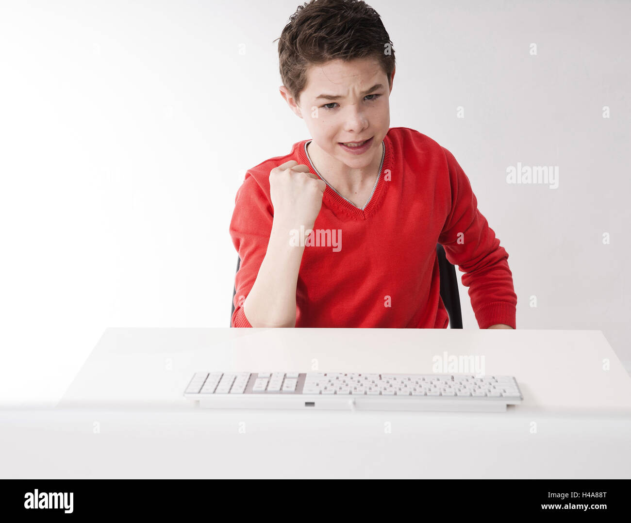 Angry boy with fist hi-res stock photography and images - Alamy