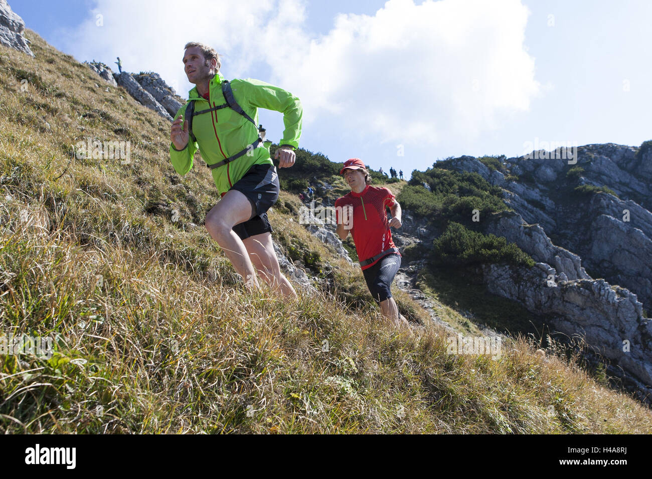 Two young mountain runners on mountain path Stock Photo - Alamy