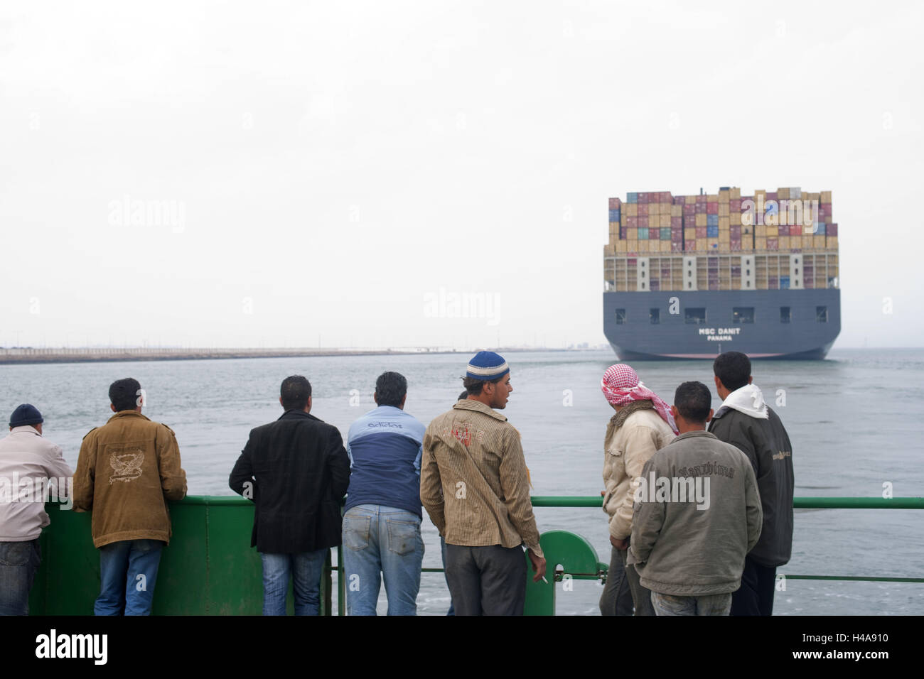 Egypt, port Said, container ship in the Suez Canal, view of a ferry ...