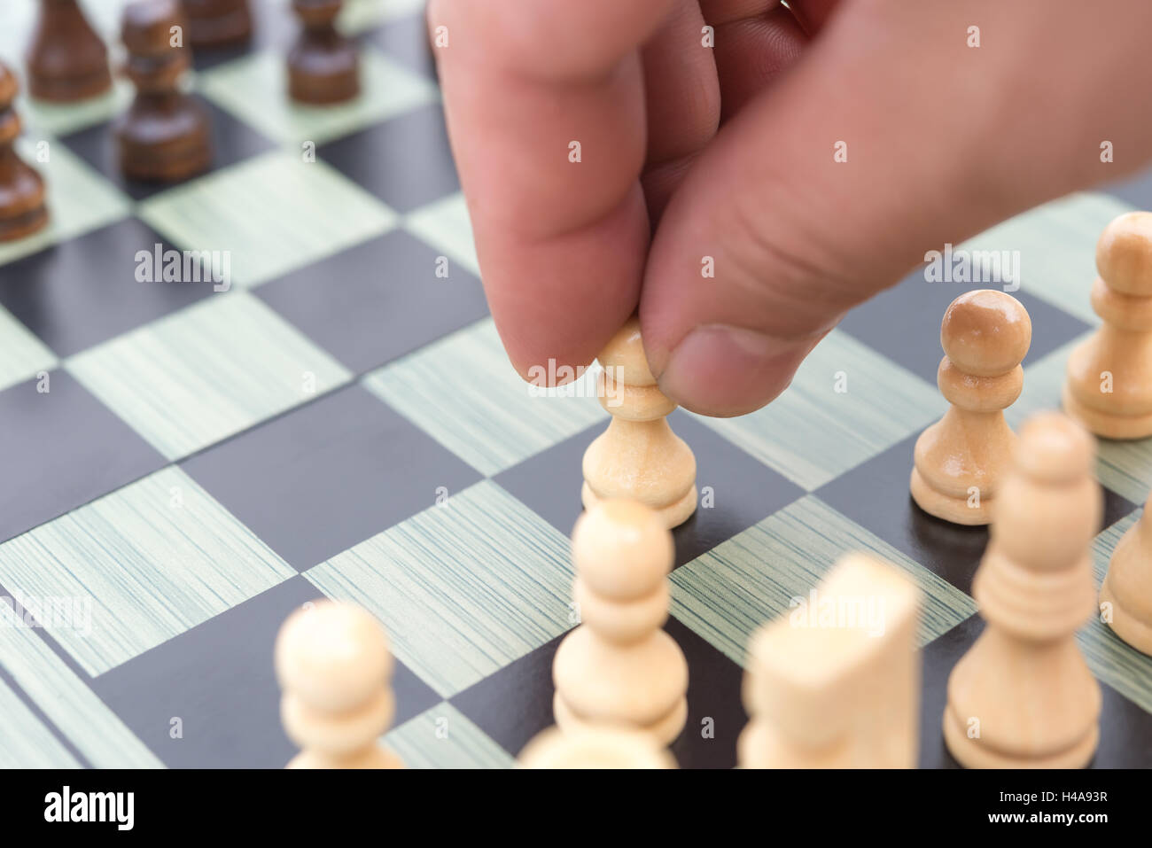 white Pawn of chess moving forward Stock Photo - Alamy