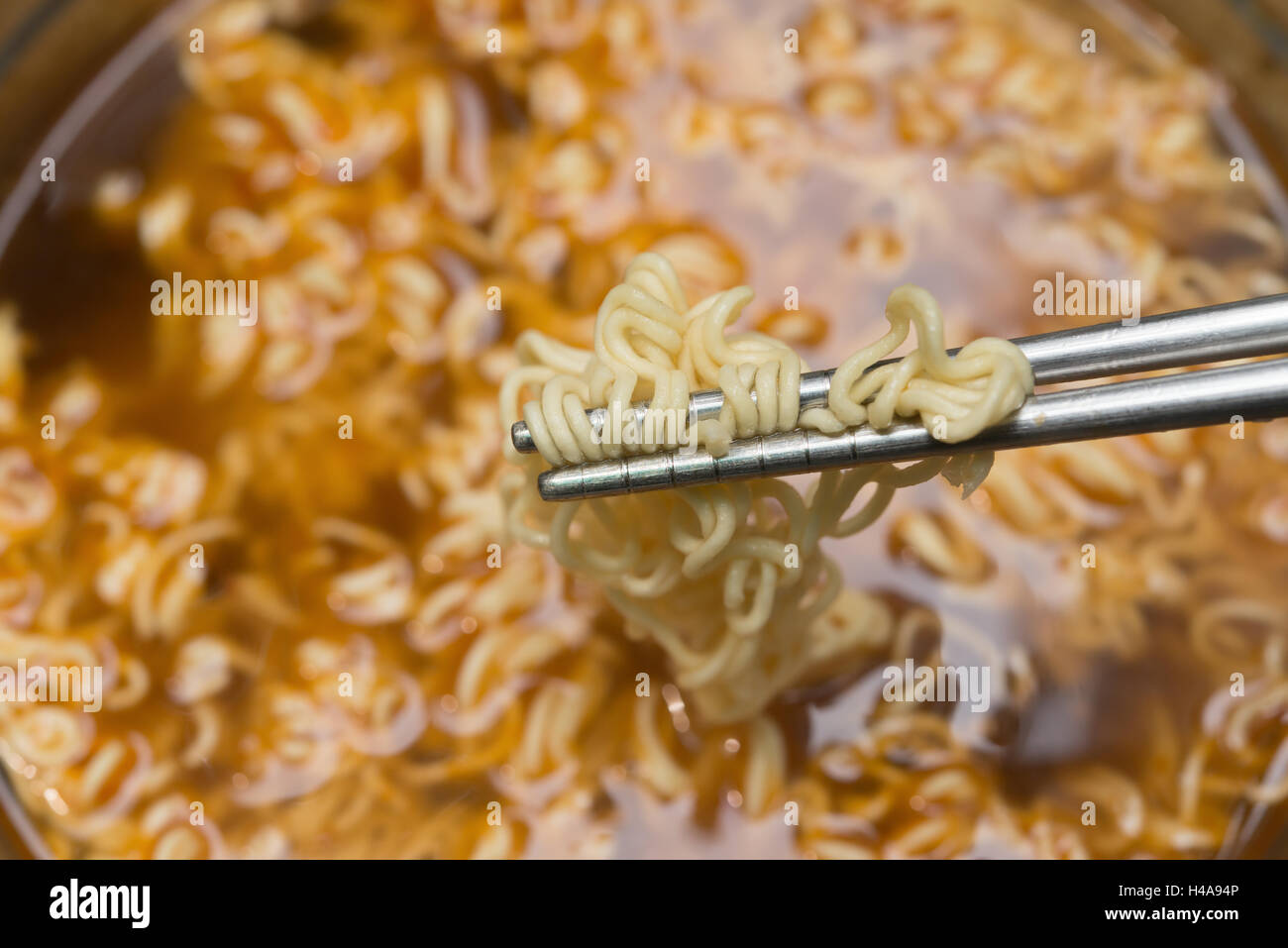 chopstick picking up instant noodles with beef flavor sauce Stock Photo ...