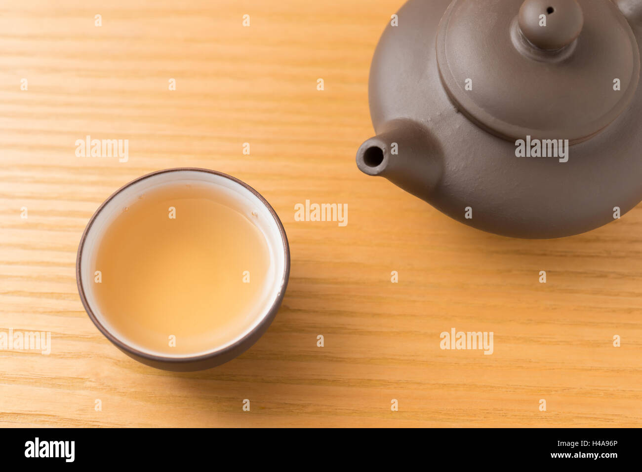 top view cup of tea and teapot on wood table Stock Photo - Alamy