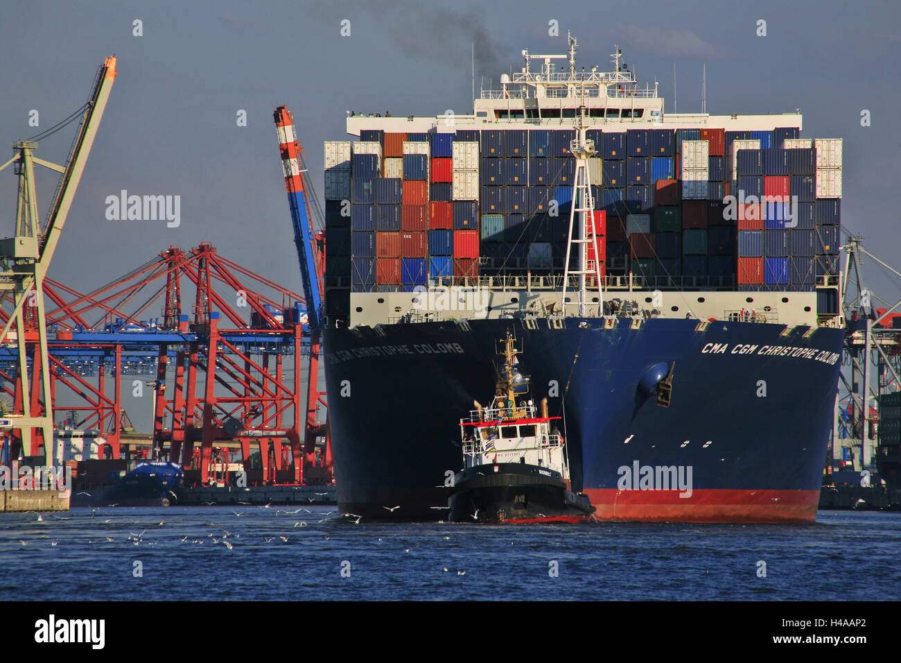 Tugboats turning the container ship 'Christophe Colomb' Stock Photo - Alamy