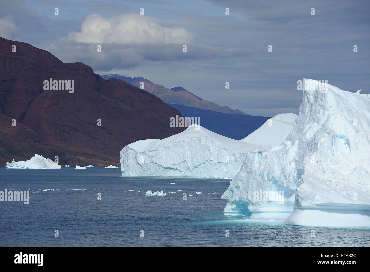 Iceberg, red mountain in the background, mountain, Clearing fjord ...