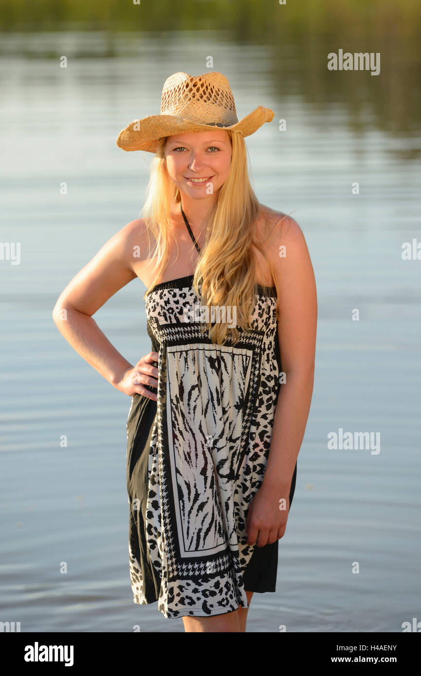 Young woman, half portrait, head-on, standing, looking at camera Stock ...