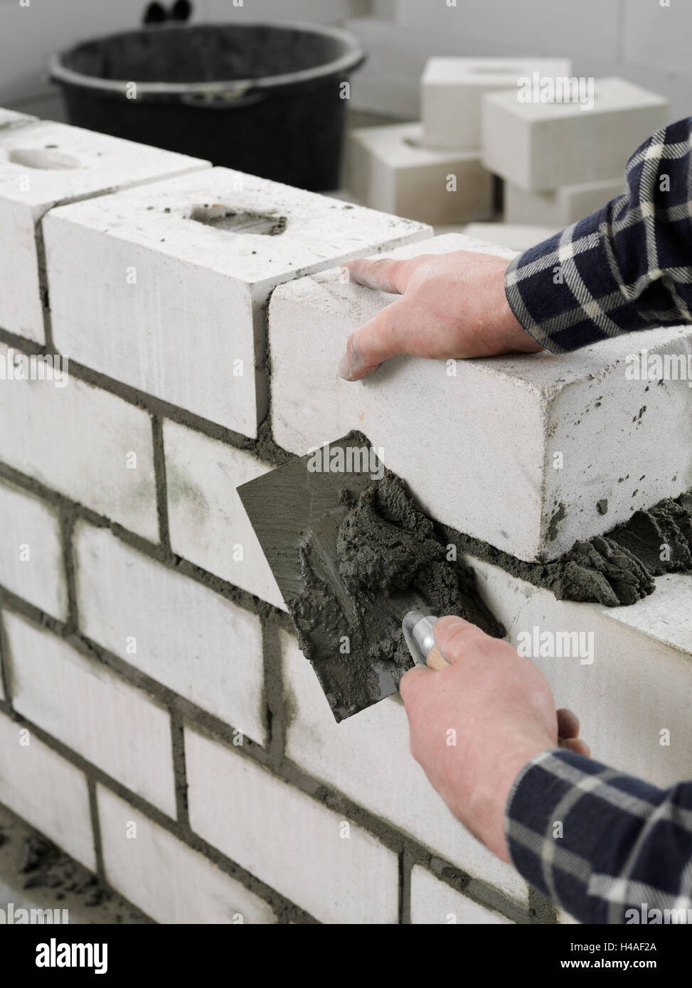 Building site, shell construction, man, hand, stonewall, instructions ...