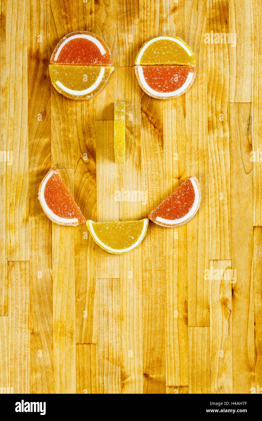 Smiley on table made from jellybeans Stock Photo - Alamy