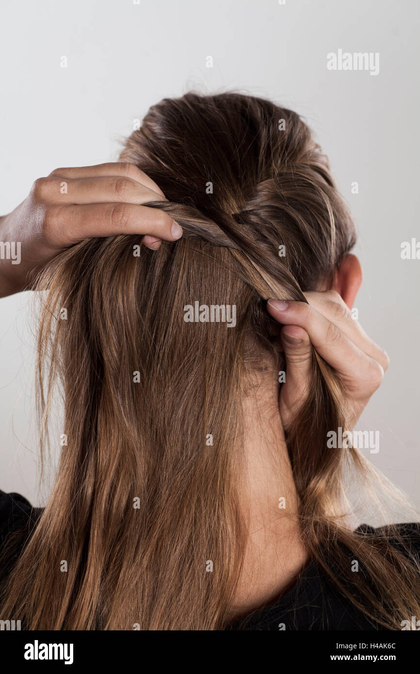Instructions braided bun step 3 of 4 Stock Photo - Alamy