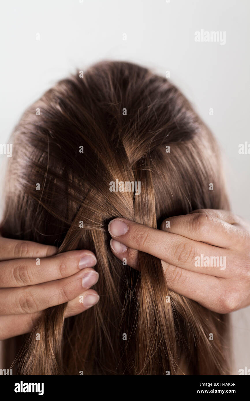 Instructions braided hairstyle plait rear view step 1 of 2 Stock Photo ...