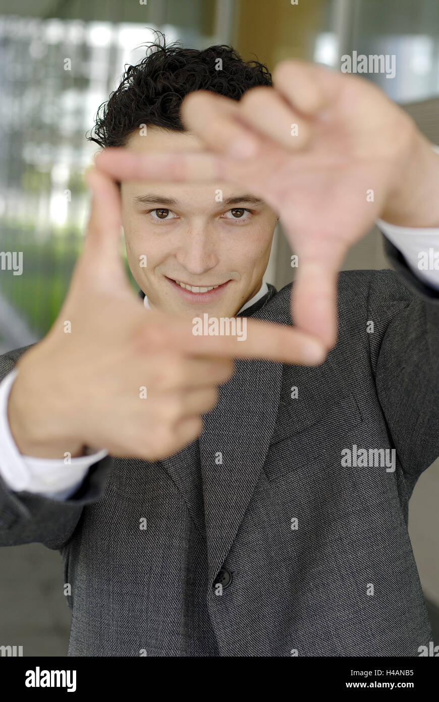 Man, young, standing, gesture, fingers, neck, measuring Stock Photo - Alamy