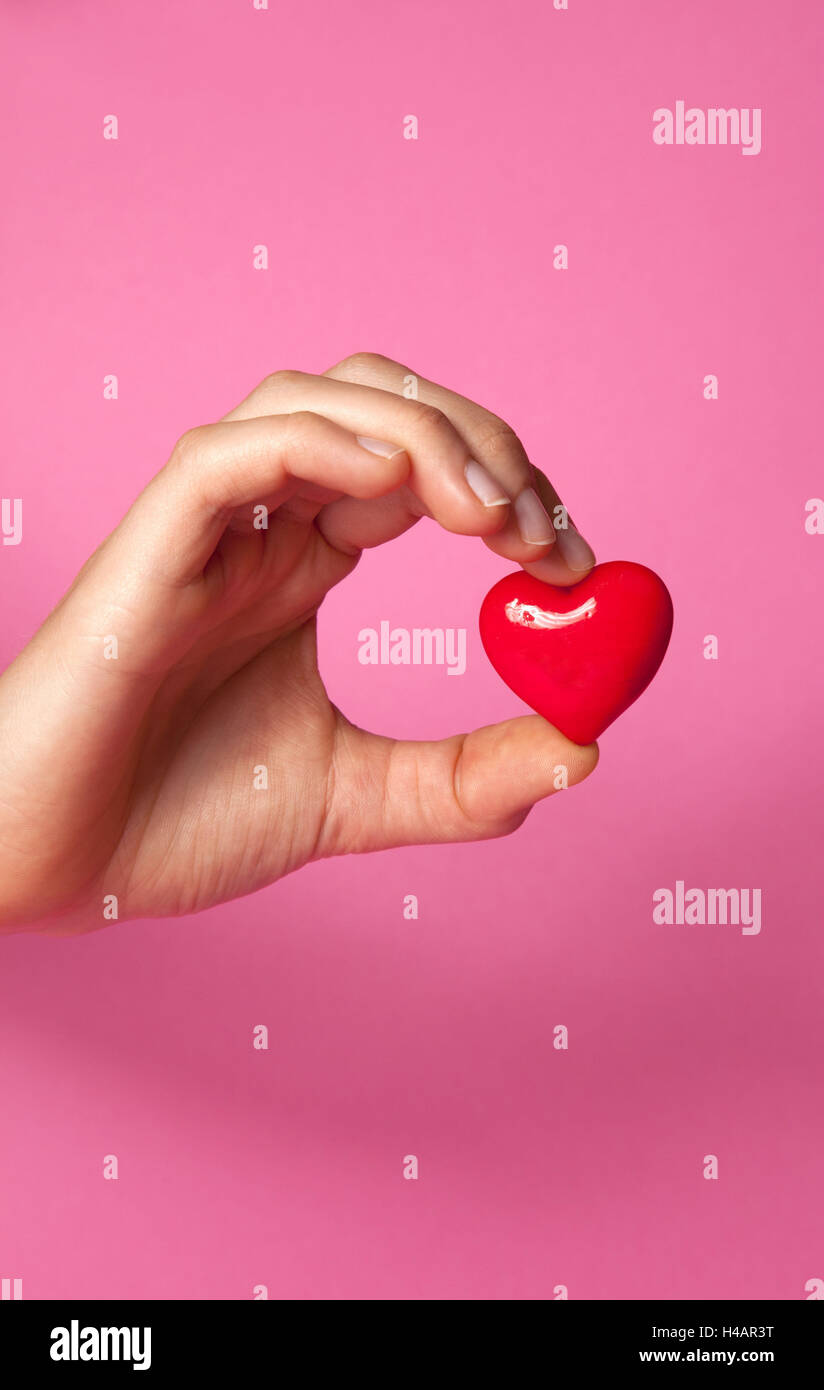 Hand offering heart symbol hi-res stock photography and images - Alamy