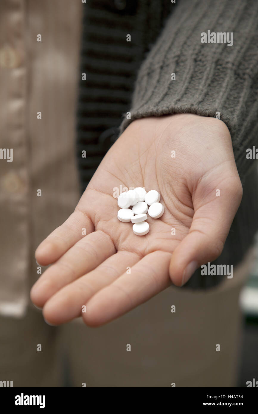 Woman, hand, pills, disease, health Stock Photo - Alamy
