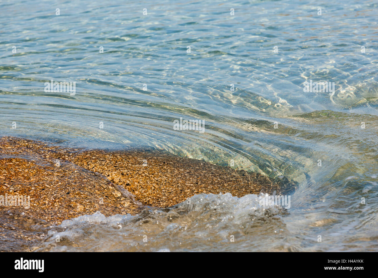 Rock in the water Stock Photo - Alamy