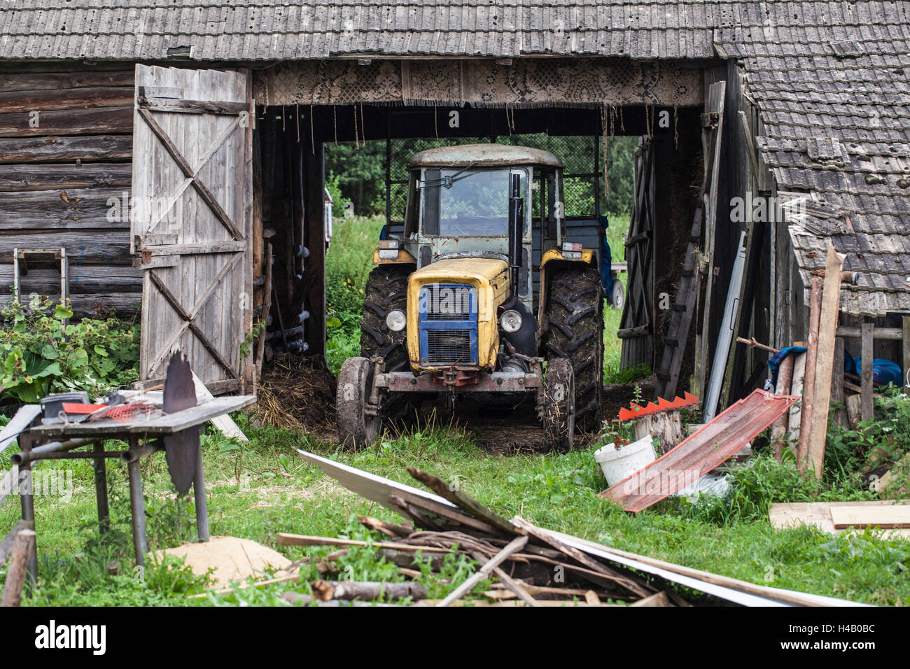 old tractor in the garage Stock Photo - Alamy