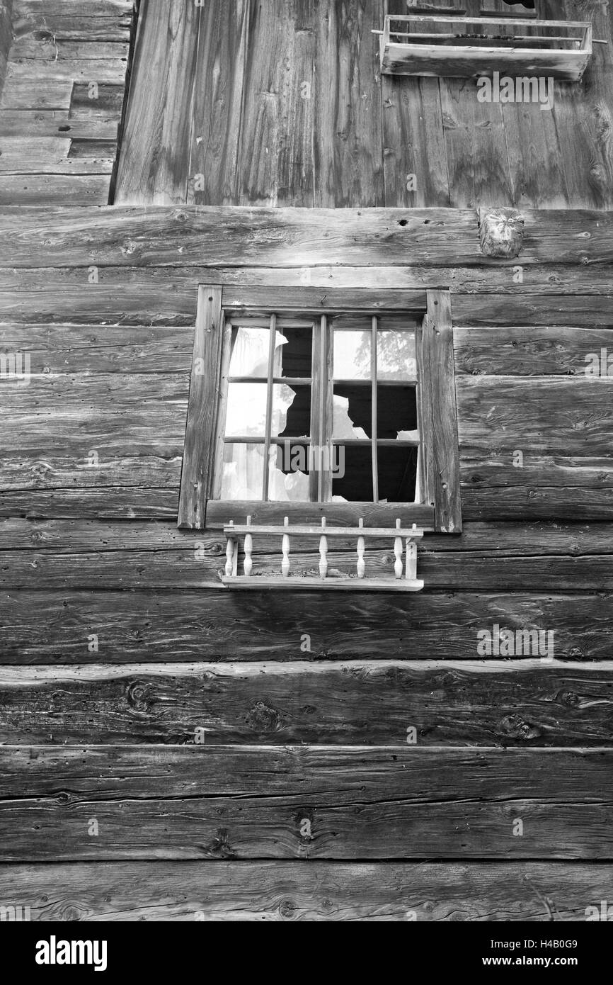 Broken glass in the window of a wooden hut Stock Photo - Alamy
