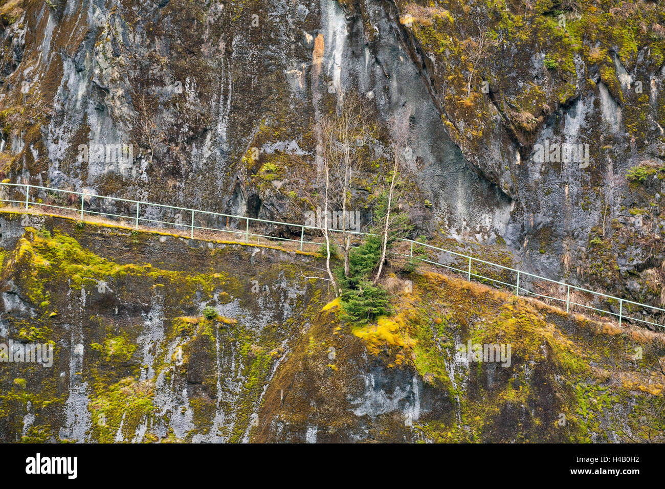 Way with railing at rock face Stock Photo - Alamy