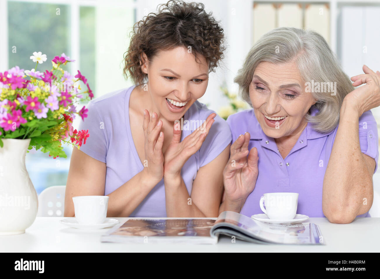Senior woman daughter magazine hi-res stock photography and images - Alamy