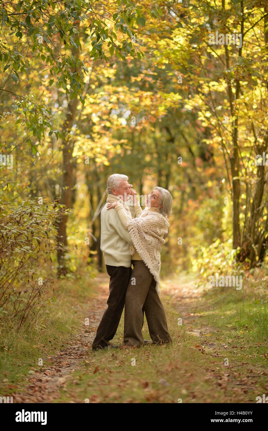 Happy middle-aged couple dancing in the autumn park Stock Photo - Alamy