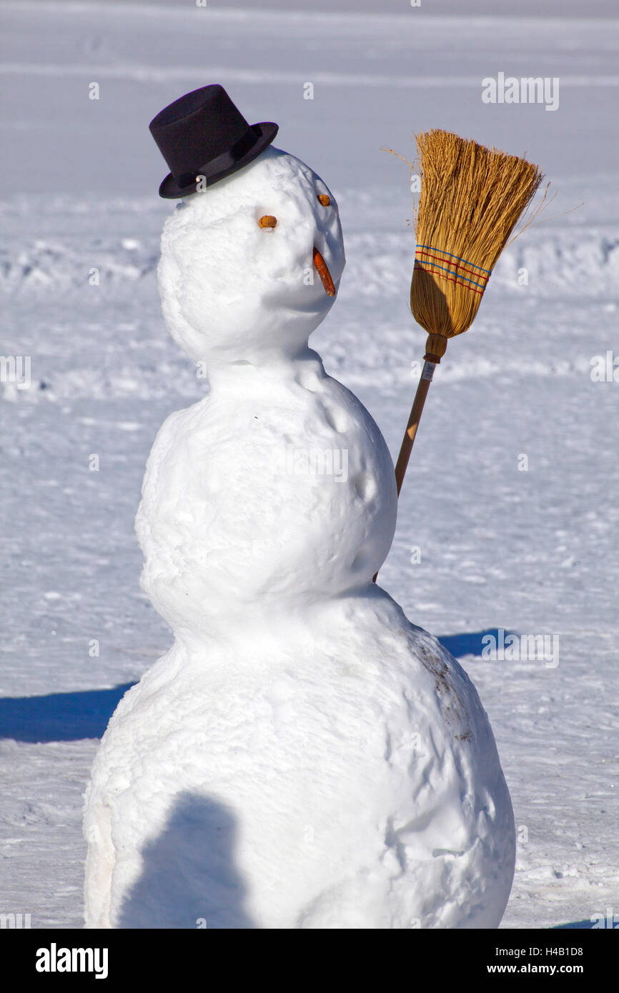 Snowmen with hat and broom Stock Photo - Alamy