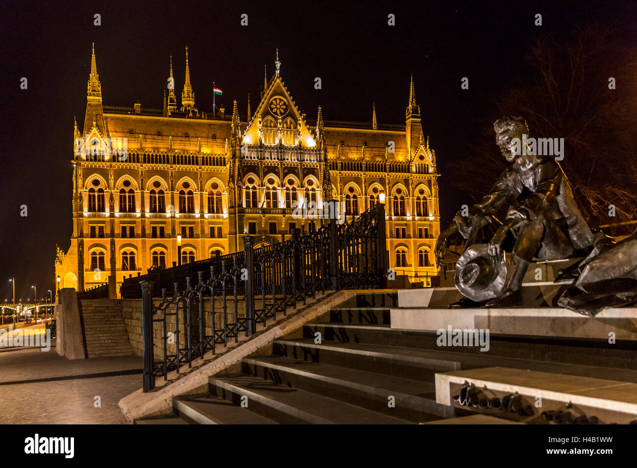 Parliament, in front the sitting statue of the writer József Attila ...