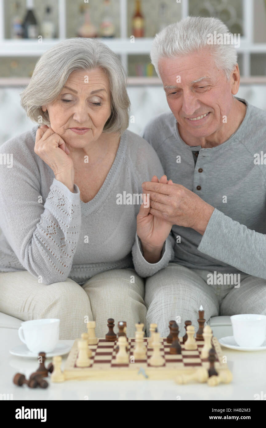 Woman playing chess indoors grey hi-res stock photography and images ...