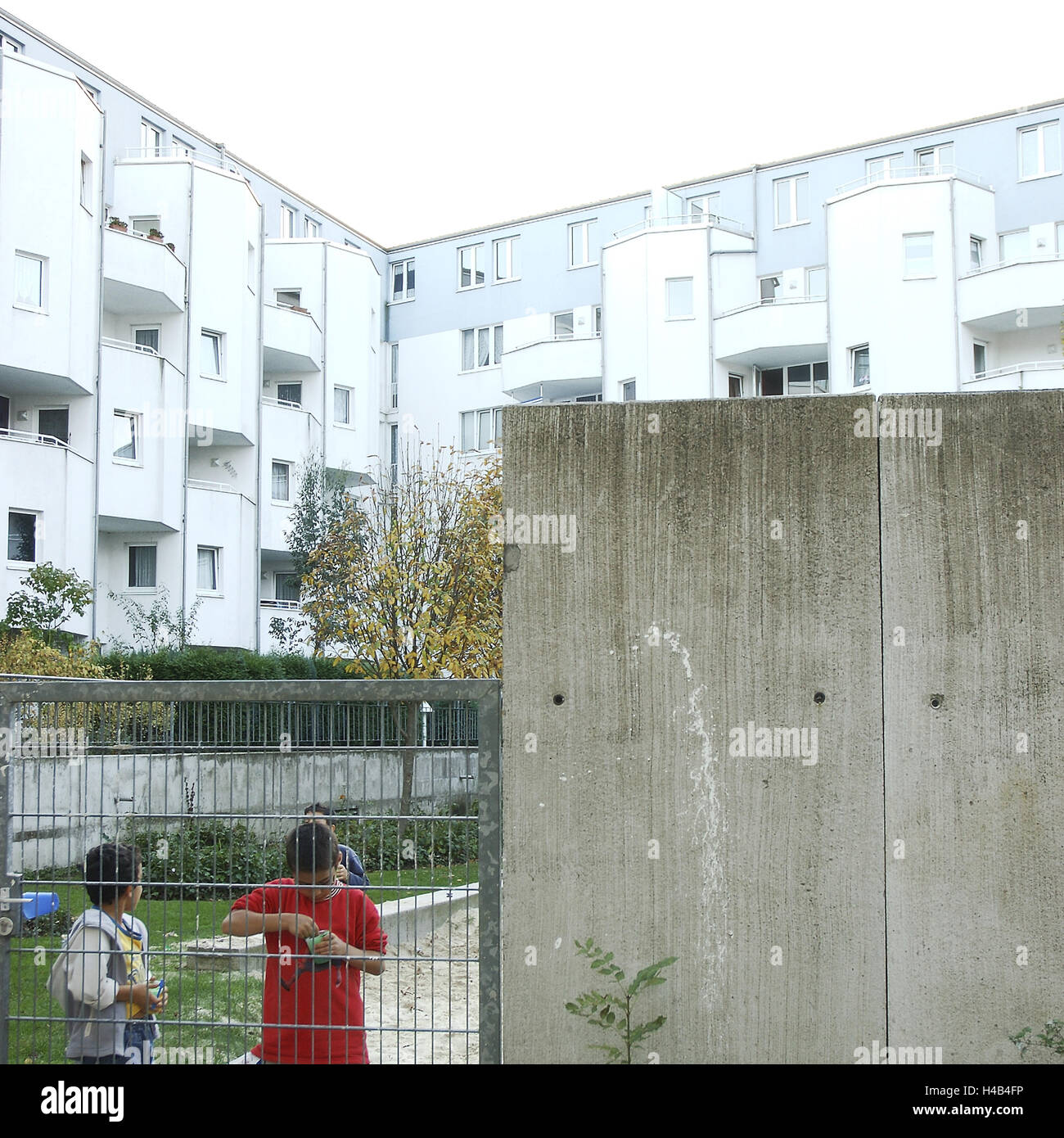 Children playing behind a fence Stock Photo - Alamy