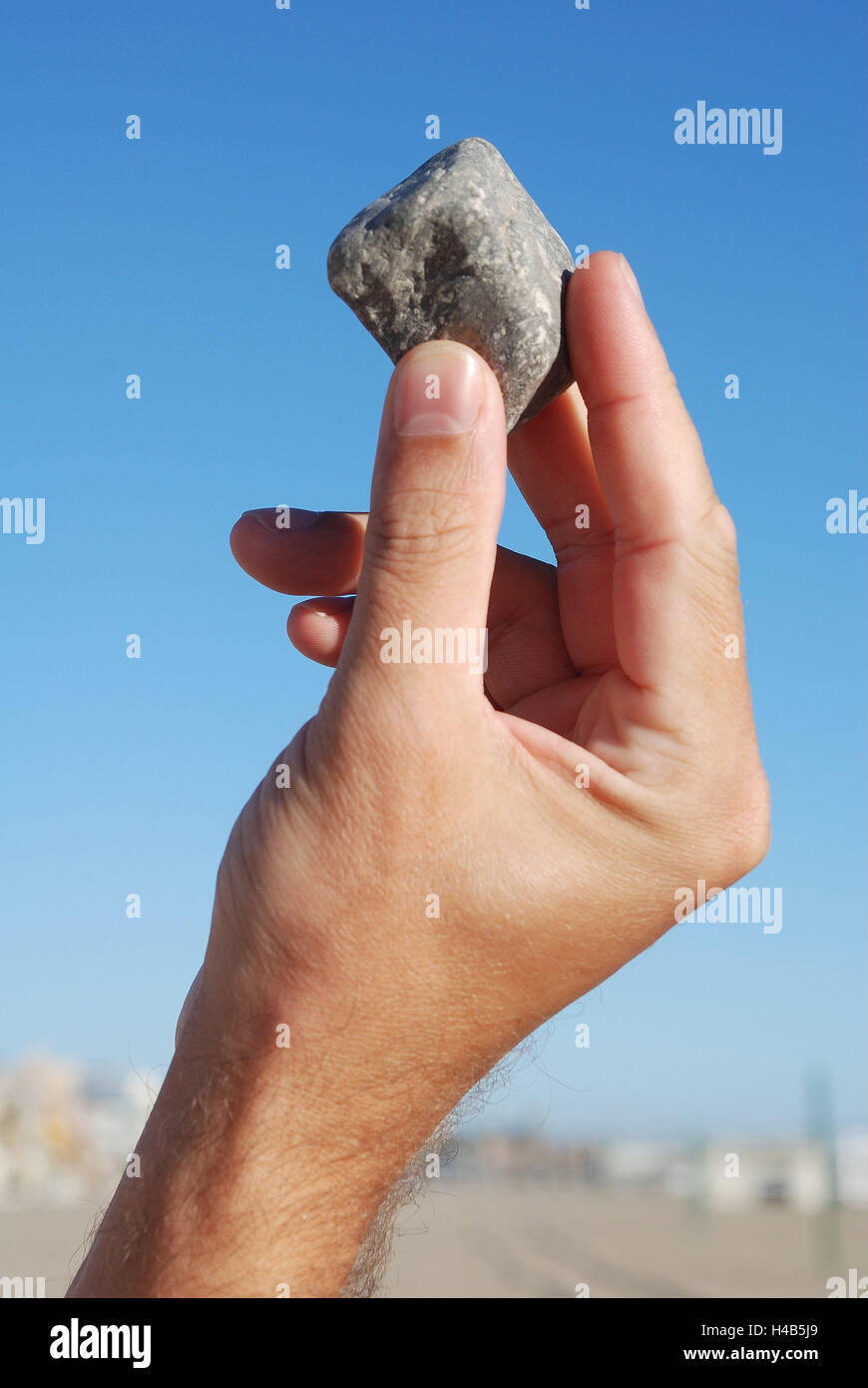 Hand, stone, showing, holding up, man's hand, man, finger, male, beach ...