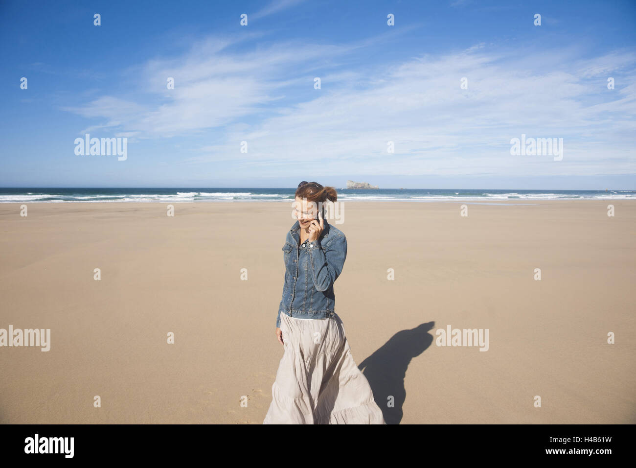 Woman calls up on the beach Stock Photo - Alamy