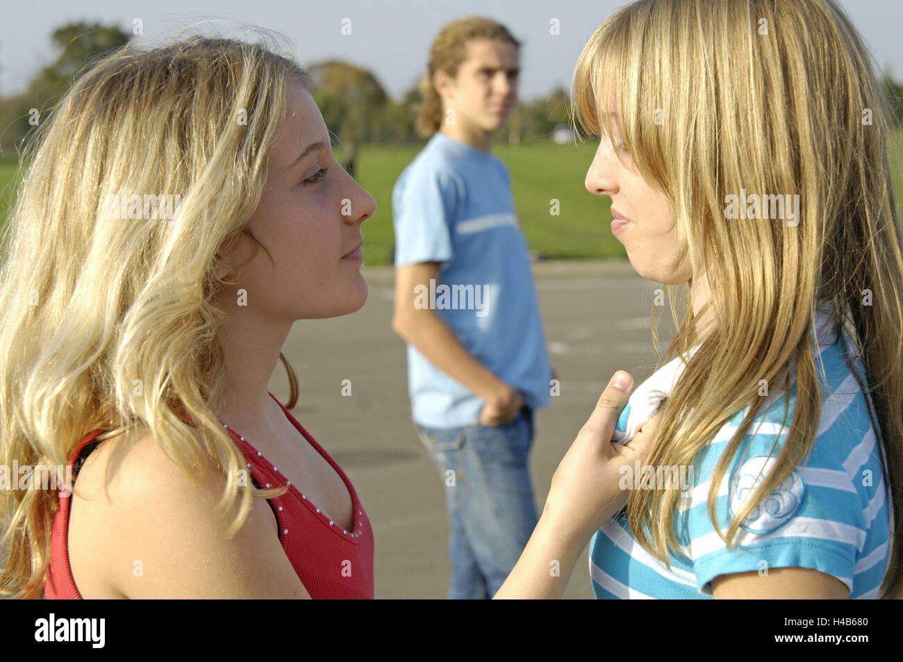 Teenage girls, conversation, conflict, contention, rivalry, boy in ...