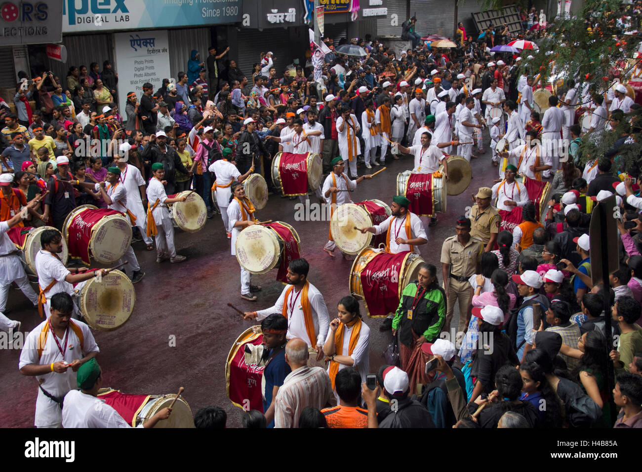 Drummers beating the drums during Ganesha Immerssion Procession, Pune ...