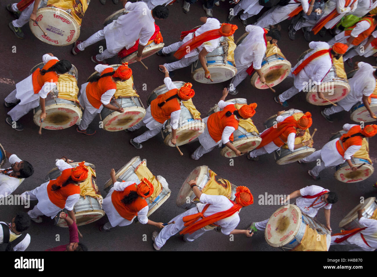 Drummers beating the drums during Ganesha Immerssion Procession, Pune ...