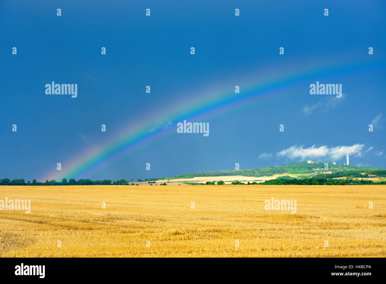 Germany, Saxony-Anhalt, Saalekreis, rainbow and storm clouds above the ...