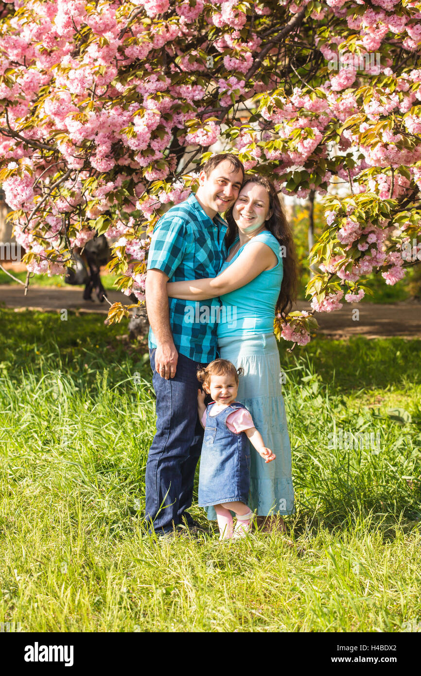 Happy family outdoor Stock Photo - Alamy