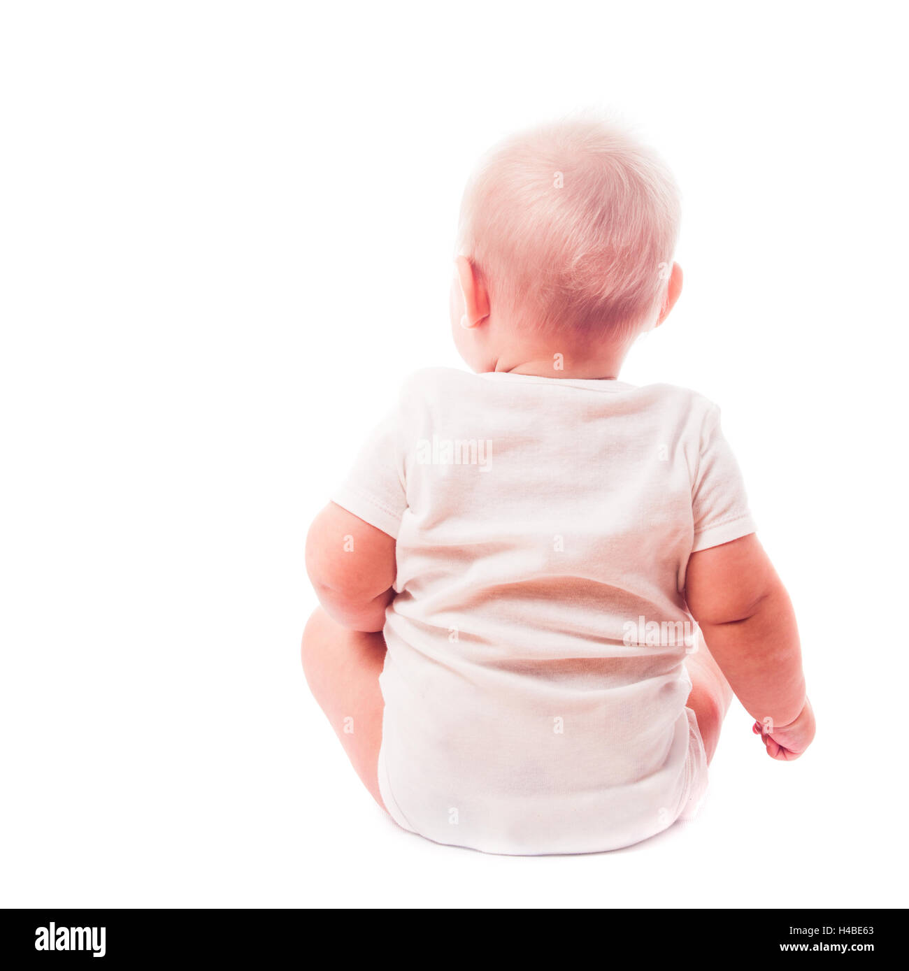 Baby looks over his shoulder Stock Photo - Alamy
