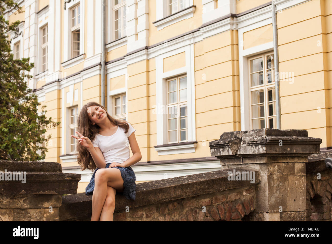 Girl near the hight school building Stock Photo - Alamy
