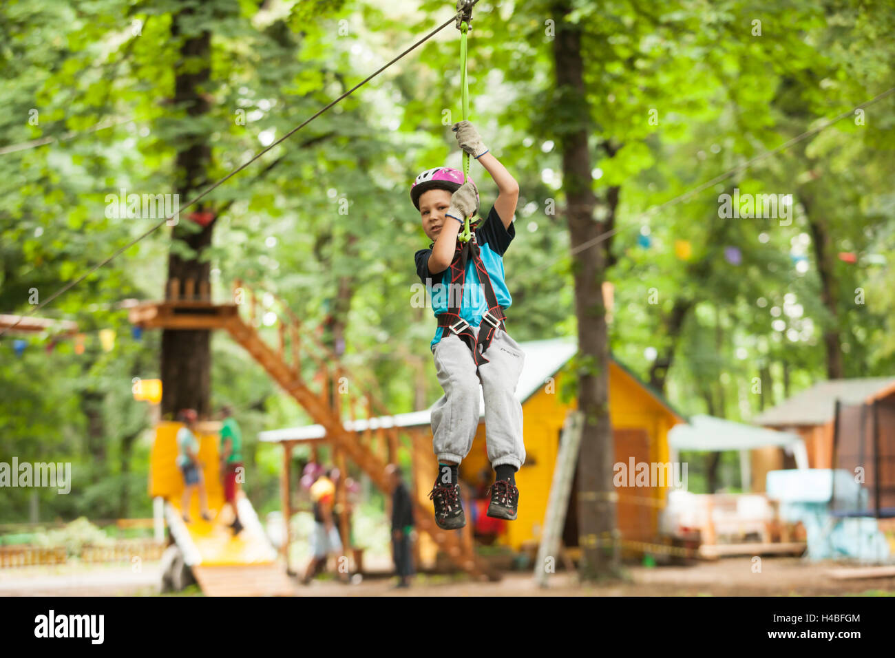 Child in a adventure playground Stock Photo - Alamy