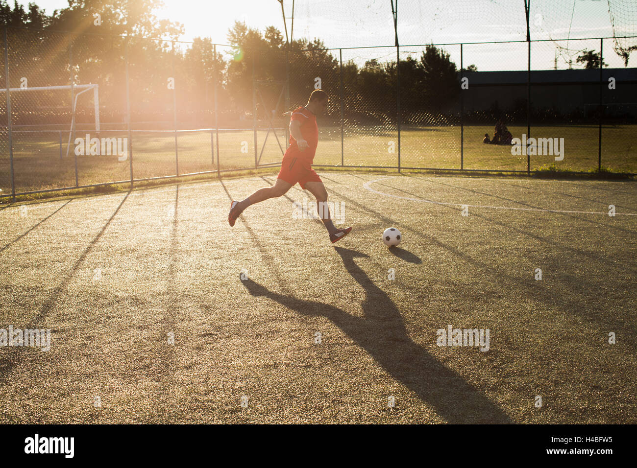 Soccer player in red Stock Photo - Alamy