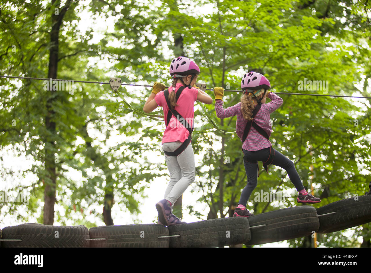 The obstacle course in adventure park Stock Photo - Alamy