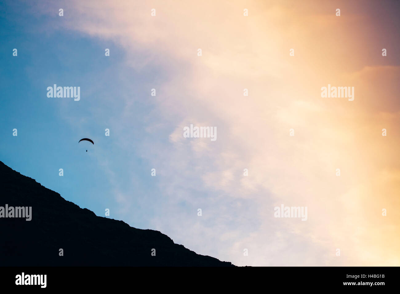 Sunset with paraglider hi-res stock photography and images - Alamy