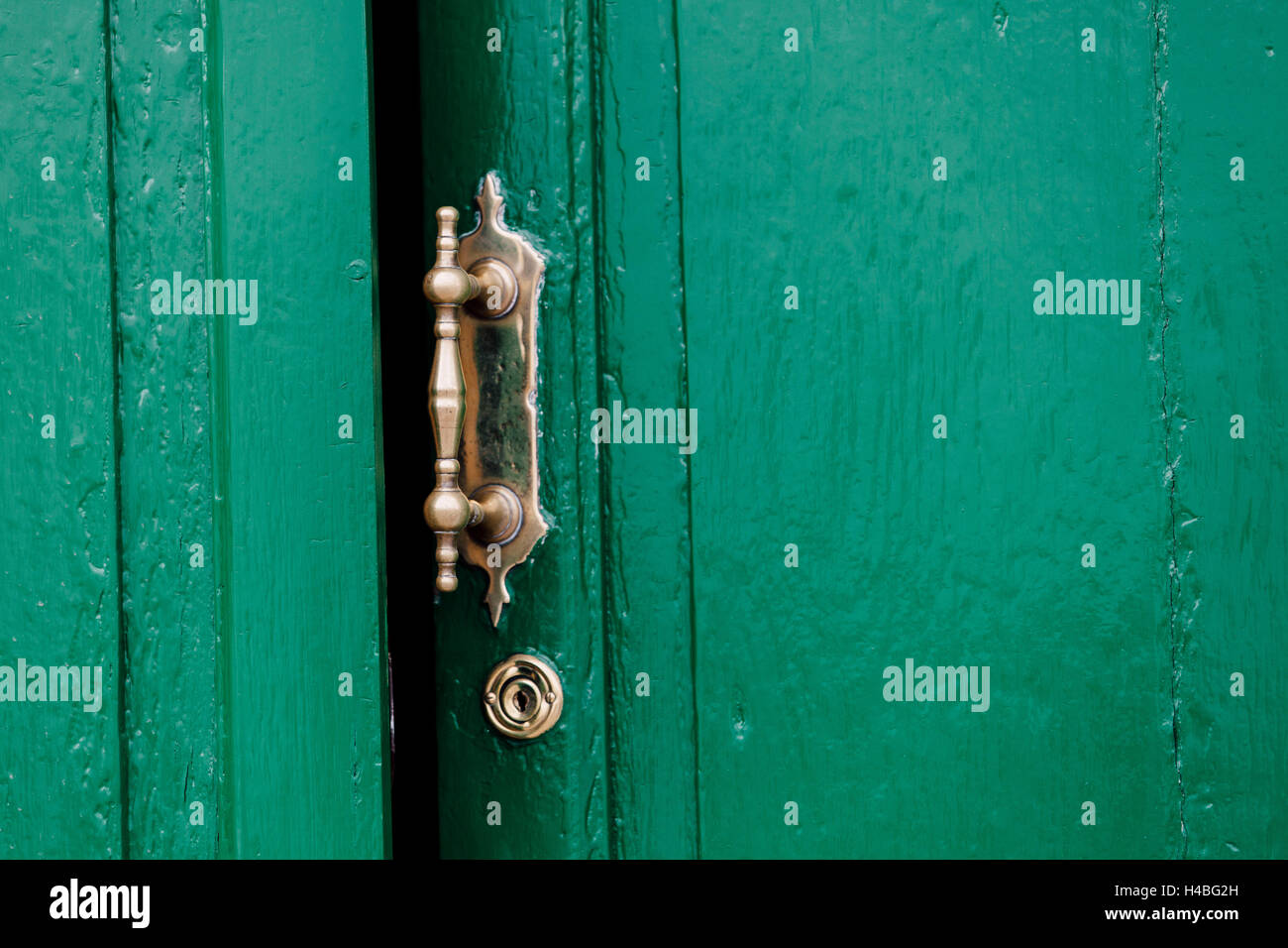 old door ajar with ornate handle Stock Photo - Alamy