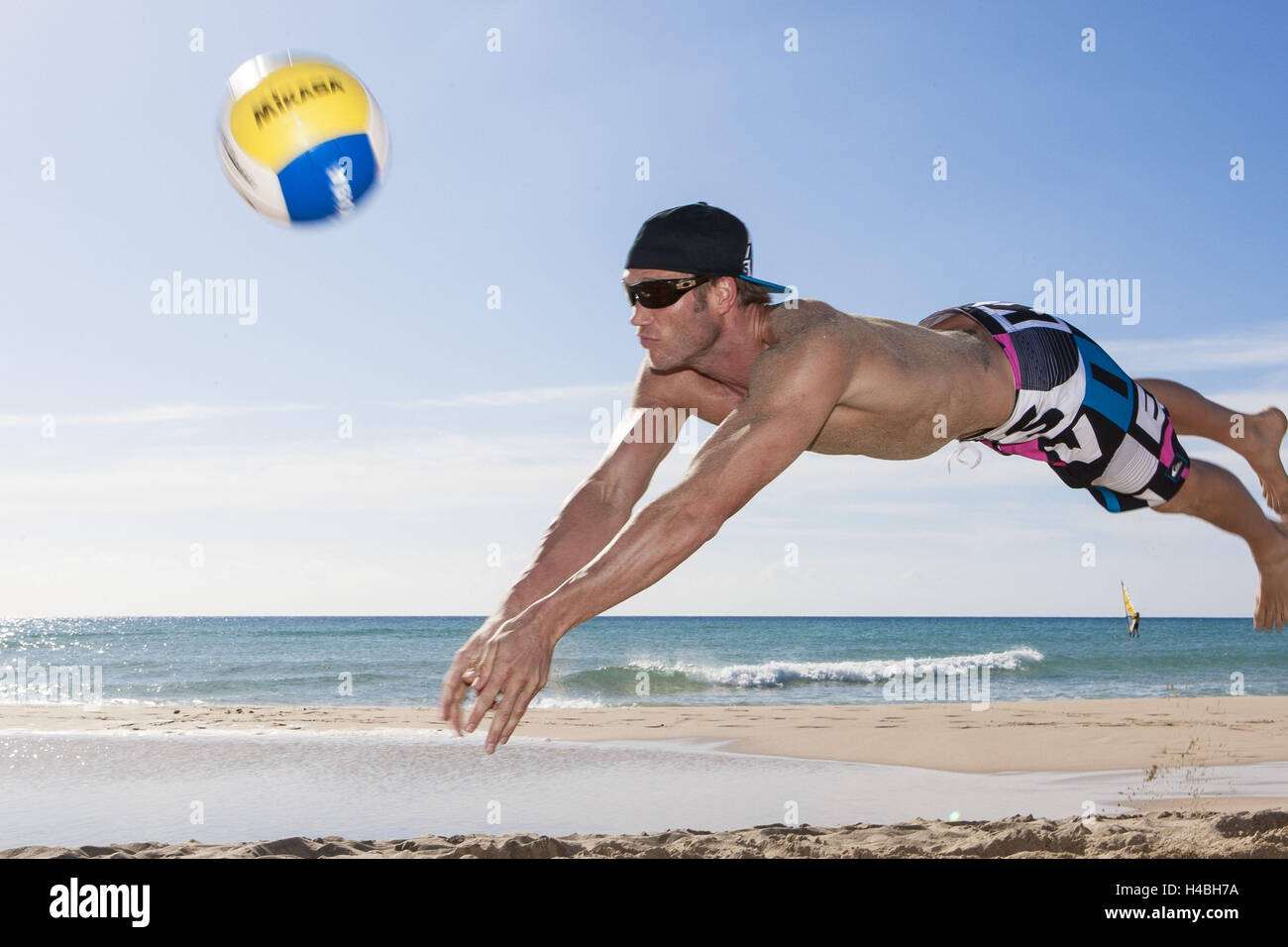 Beach volleyball player, digging on the beach Stock Photo - Alamy