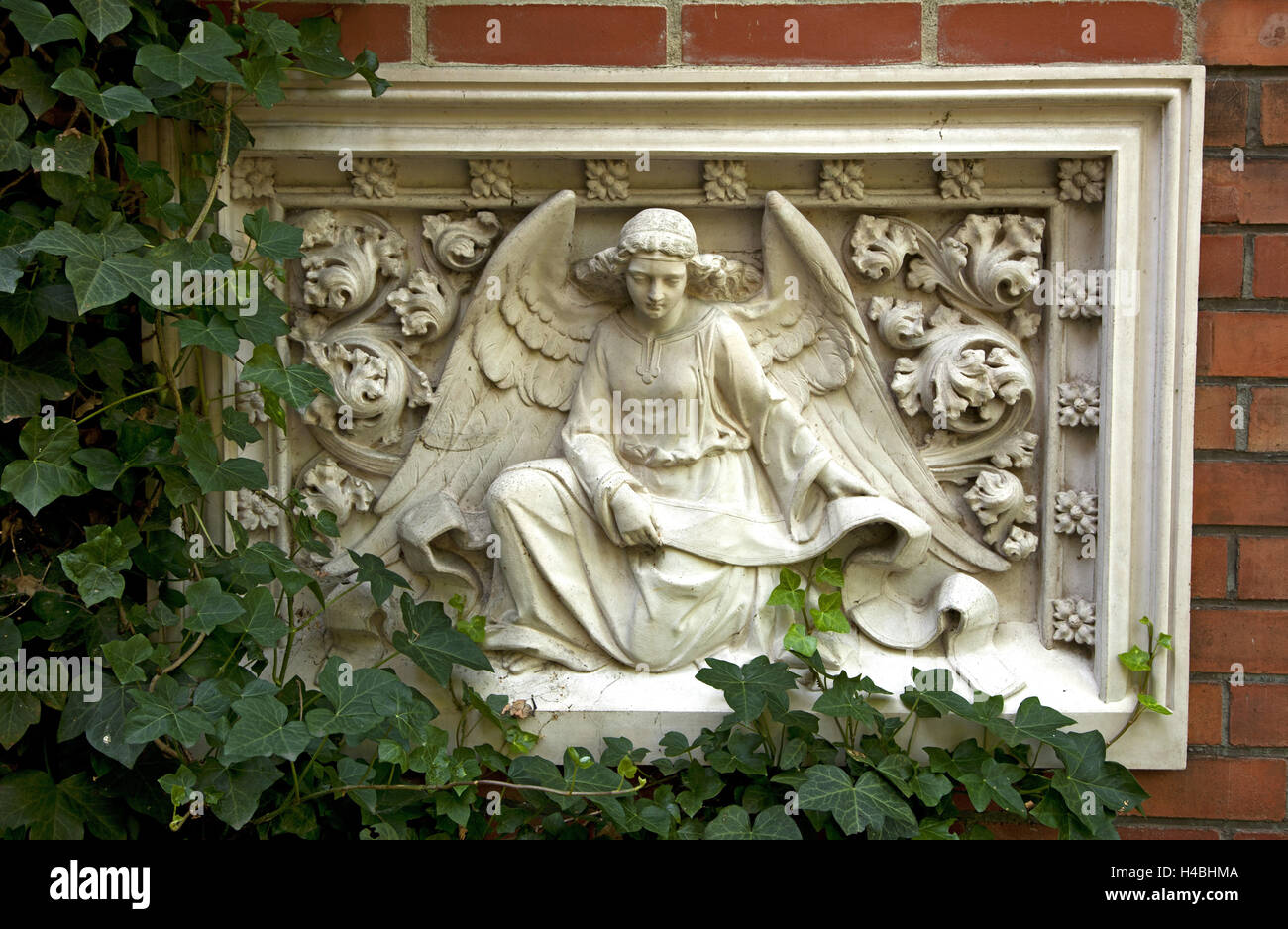 Relief, angel, gravestone, cemetery Stock Photo - Alamy