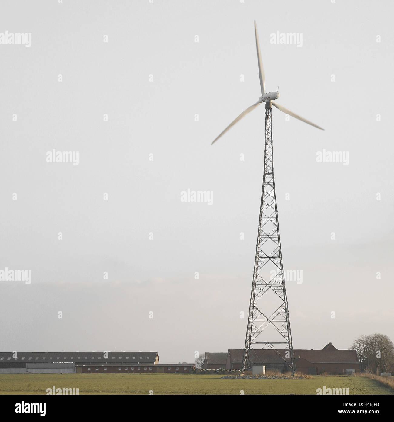 Wind turbine behind house hi-res stock photography and images - Alamy